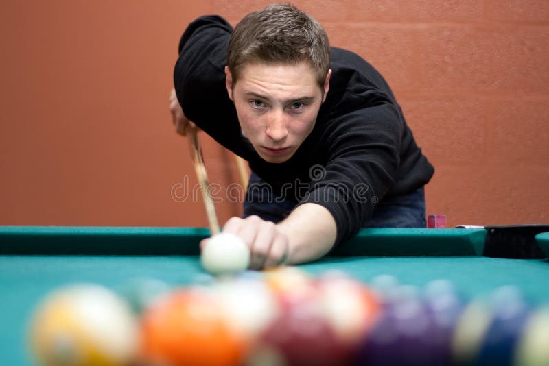 Young Man Shooting Pool stock image. Image of playing - 18665409