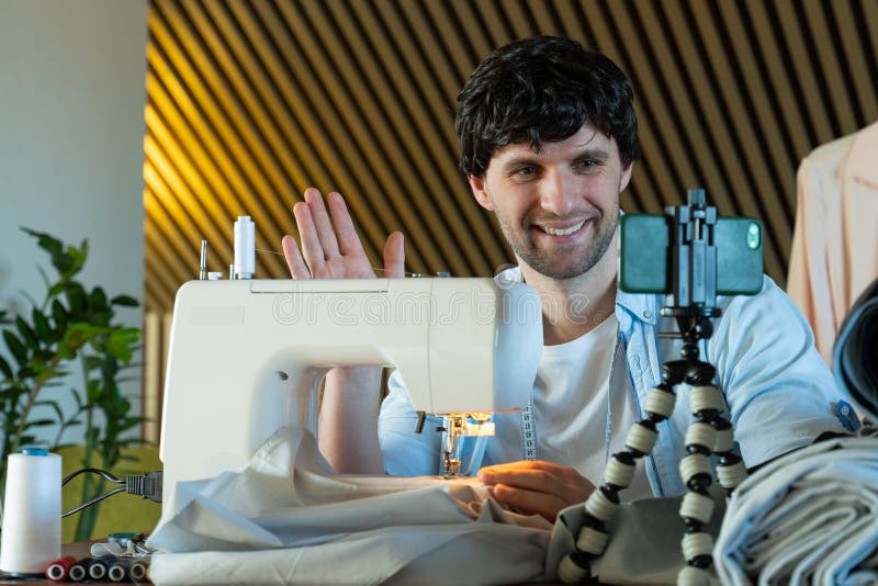 Young Man Shoots a Video Lesson, Sews on a Sewing Machine, Runs a Blog ...