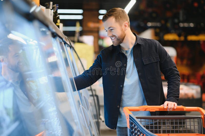 Young Man Shopping in Grocery Store. Shopping Concept Stock Photo ...