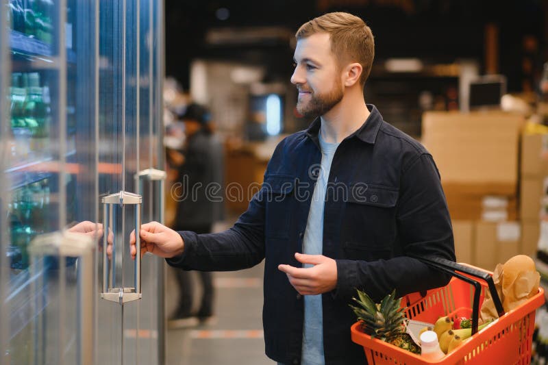Young Man Shopping in Grocery Store. Shopping Concept Stock Photo ...