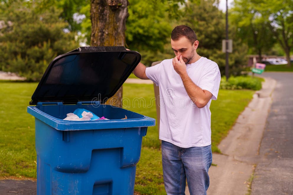 Young Man Show the Bad Smell Emanating Inside a Large Plastic Mobile ...