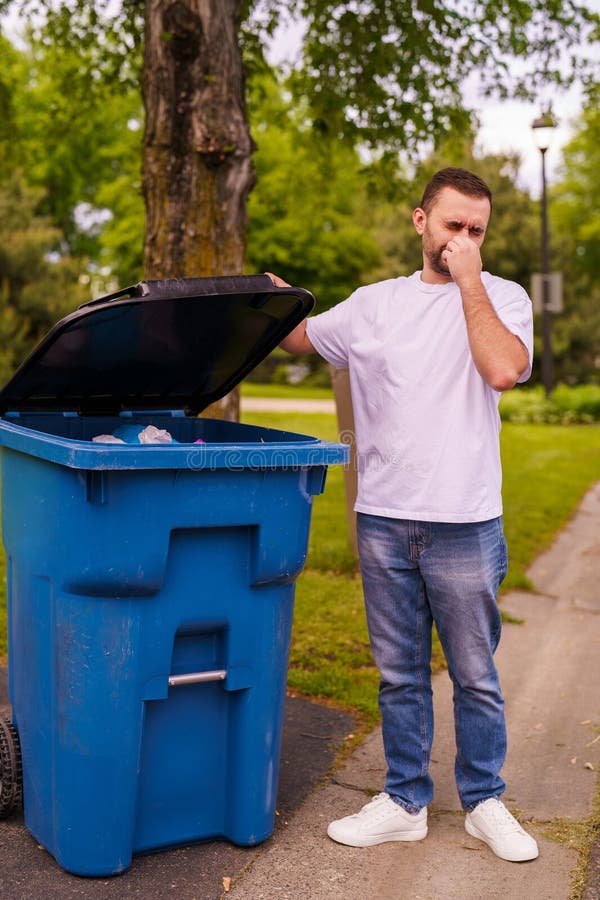 Young Man Show the Bad Smell Emanating Inside a Large Plastic Mobile ...