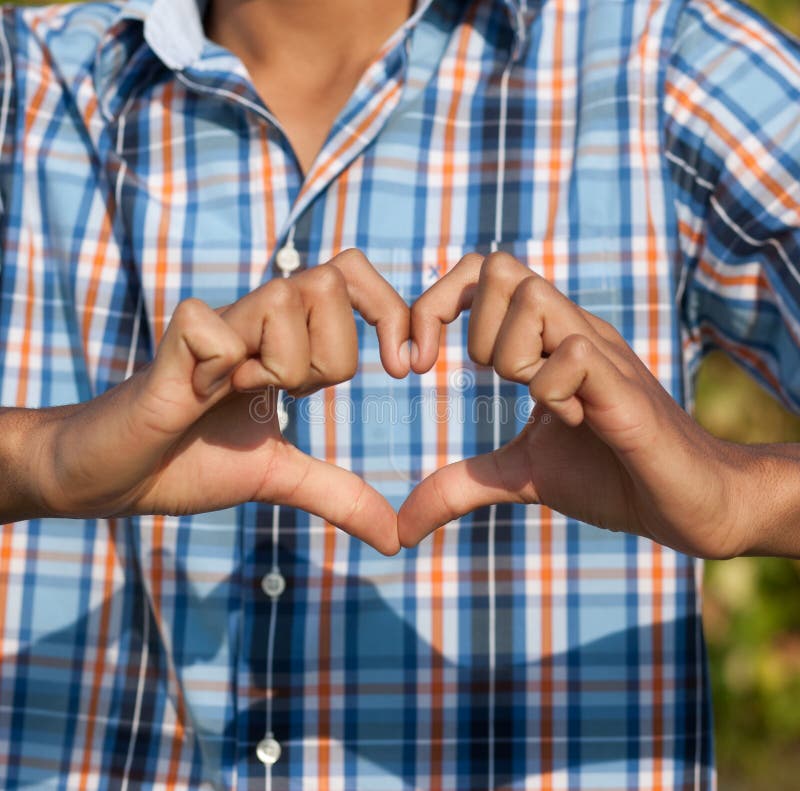 Young man show love sign stock photo. Image of happiness - 24715892