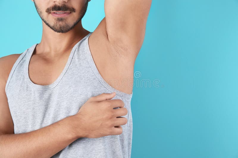 Young man showing armpit stock image. Image of care - 131260303