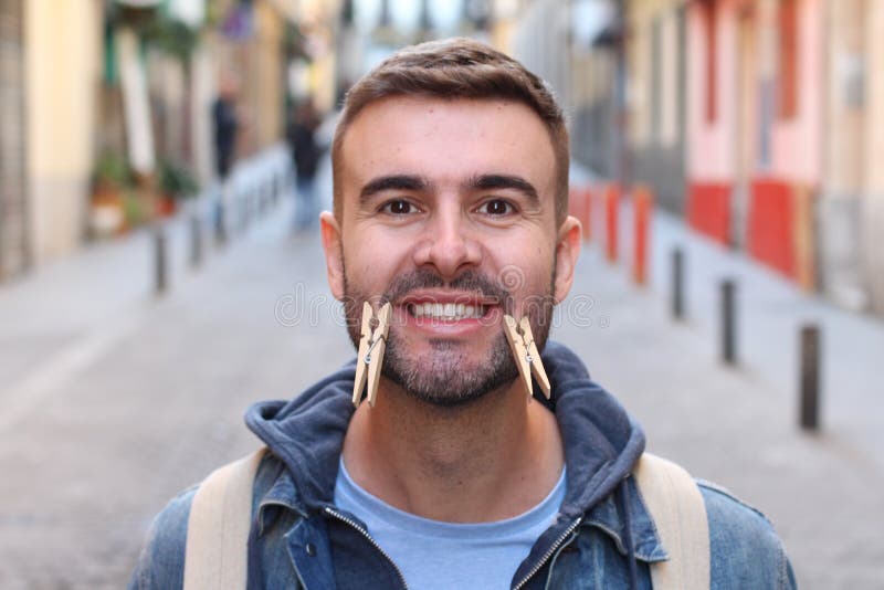 Man Showing False Front Upper Teeth Stock Photo - Image of hands, lips ...