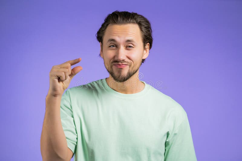 Young Man Showing Invisible Abstract Small Subject or Object. Tiny ...