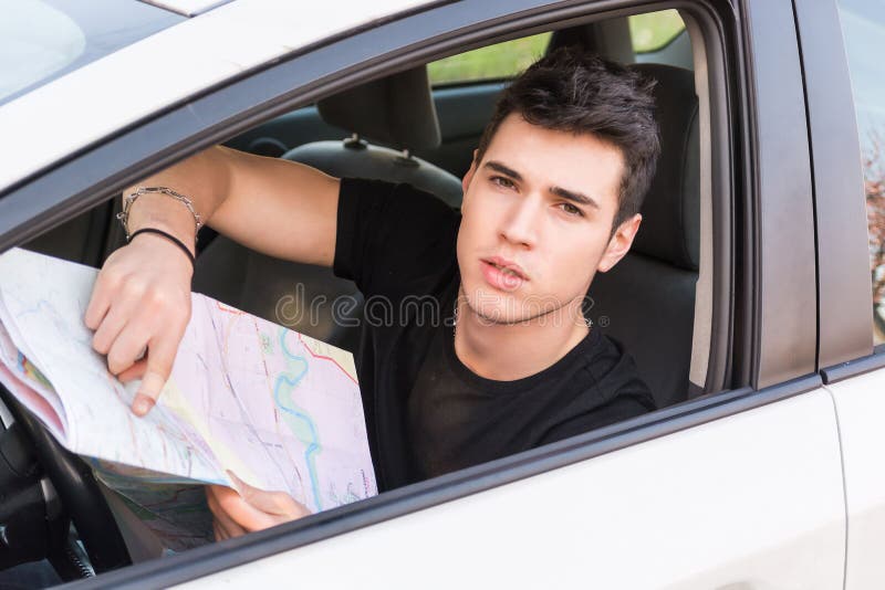 Young Man Showing Map Inside of a Car Stock Image - Image of people ...