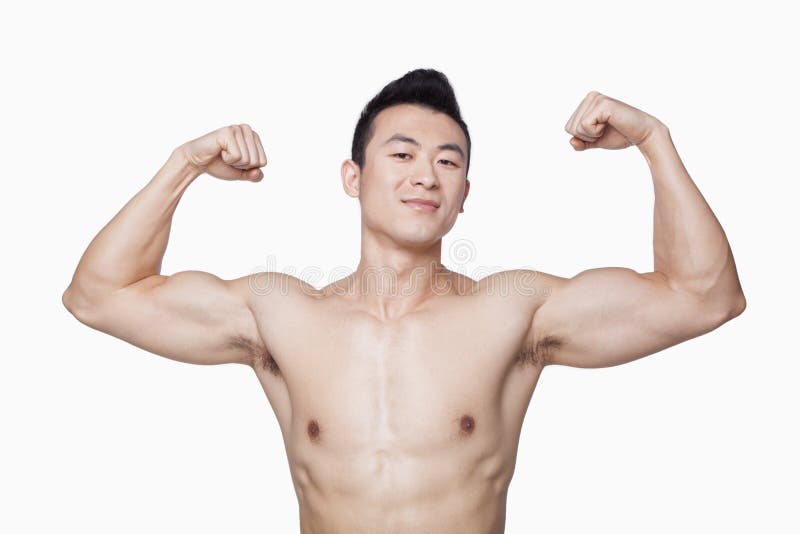 Young Man Showing Off Biceps Stock Photo - Image of muscular, ethnicity ...