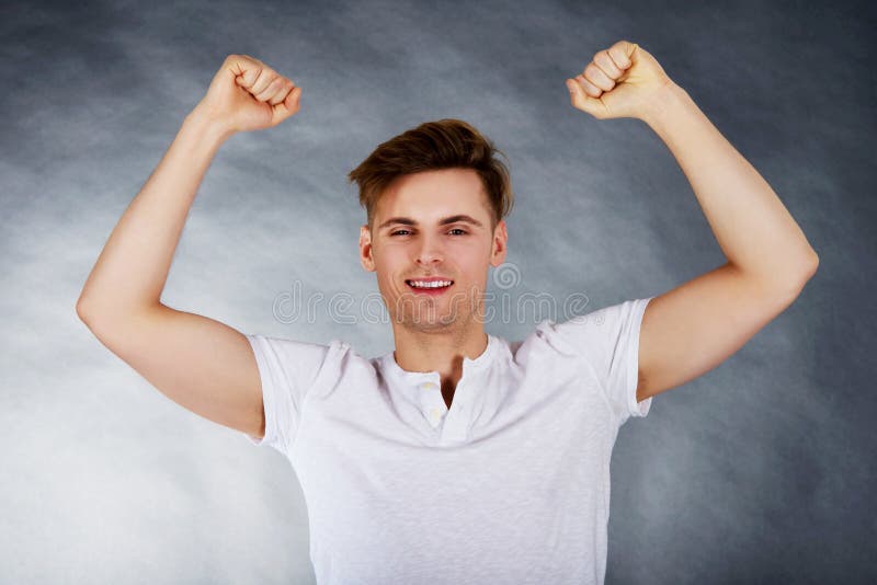 Young Man Showing Winner Gesture. Stock Image - Image of victory ...