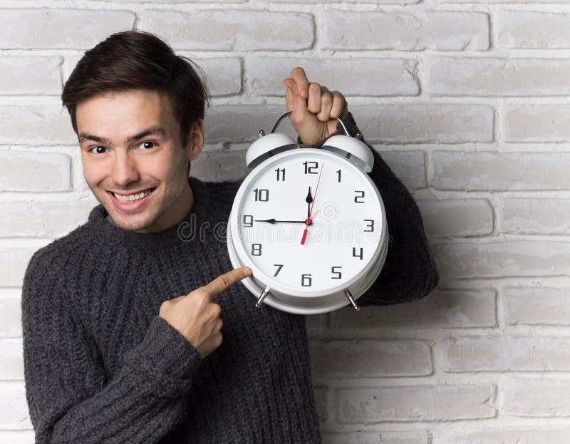 Young Man Shows on Clock stock image. Image of accuracy - 80777533