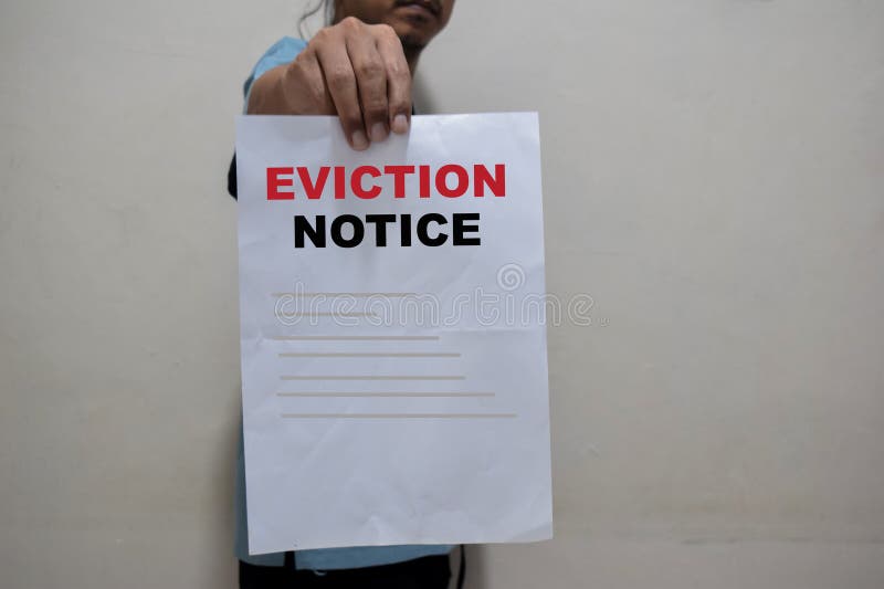 Young Man Shows a Document with the Text Eviction Notice Stock Photo ...