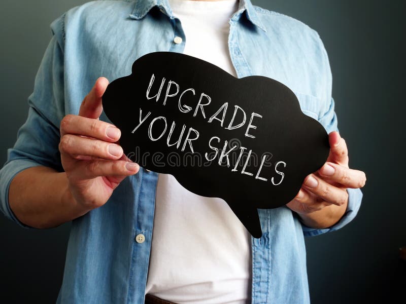 Young Man Shows a Message Upgrade Your Skills. Stock Image - Image of ...