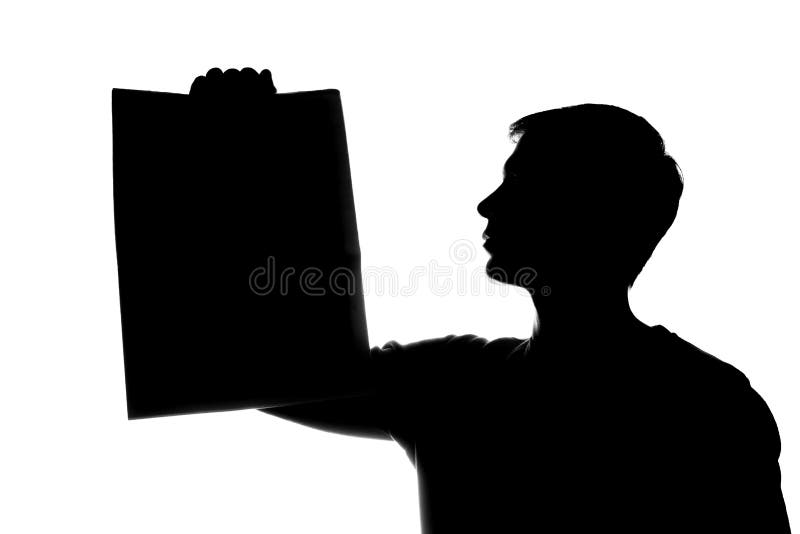 Young Man Shows a Newspaper, a Sheet of Paper - Silhouette Stock Photo ... Young Man Shows a Newspaper, a Sheet of Paper - Silhouette Stock Photo ...