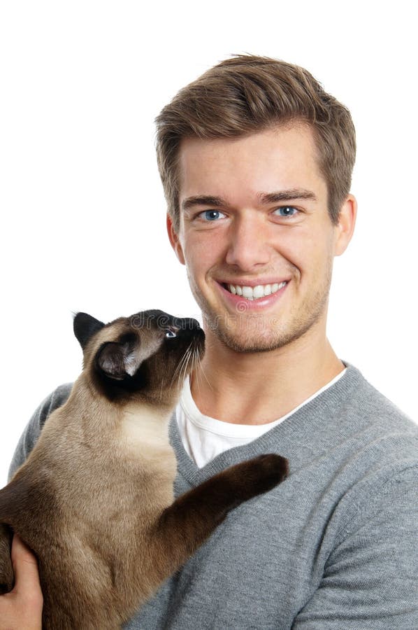 Young man with siamese cat stock photo. Image of isolated - 36364032