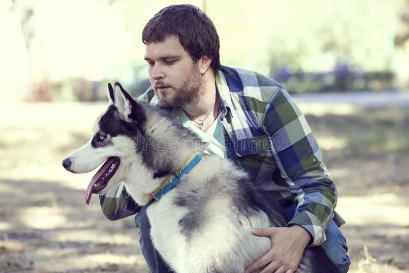 Young Man and the Siberian Husk Stock Image - Image of canine, black ...