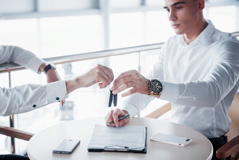 A Young Man Signs Documents in the Office, Successful Sales and Key ...
