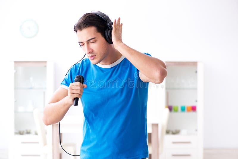 The Young Man Singing at Home Karaoke Stock Photo - Image of concert ...