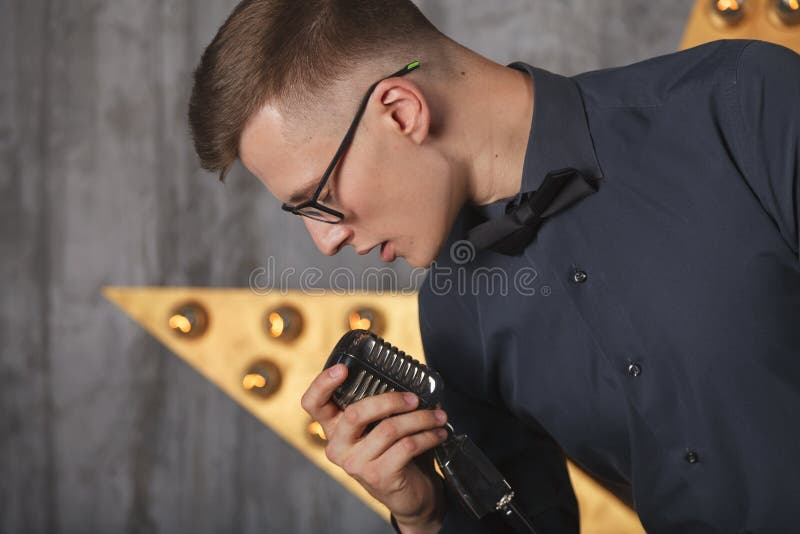 Young Man Singing with Microphone Stock Image - Image of artist, singer ...
