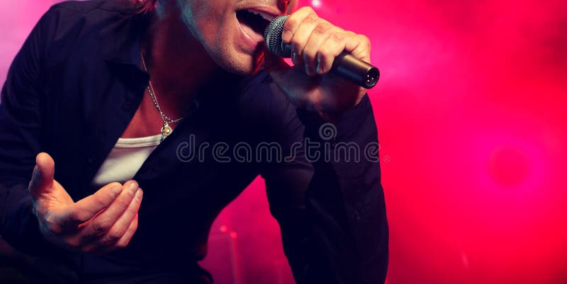 Young Man Singing at Rock Concert Stock Photo - Image of performer ...