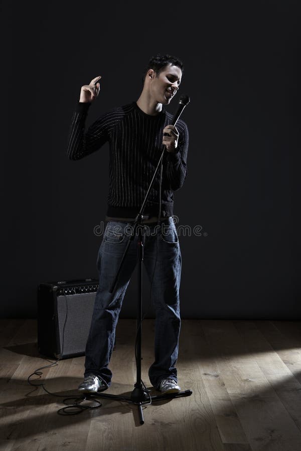 Young Man Singing into Microphone Close-up Stock Photo - Image of ...