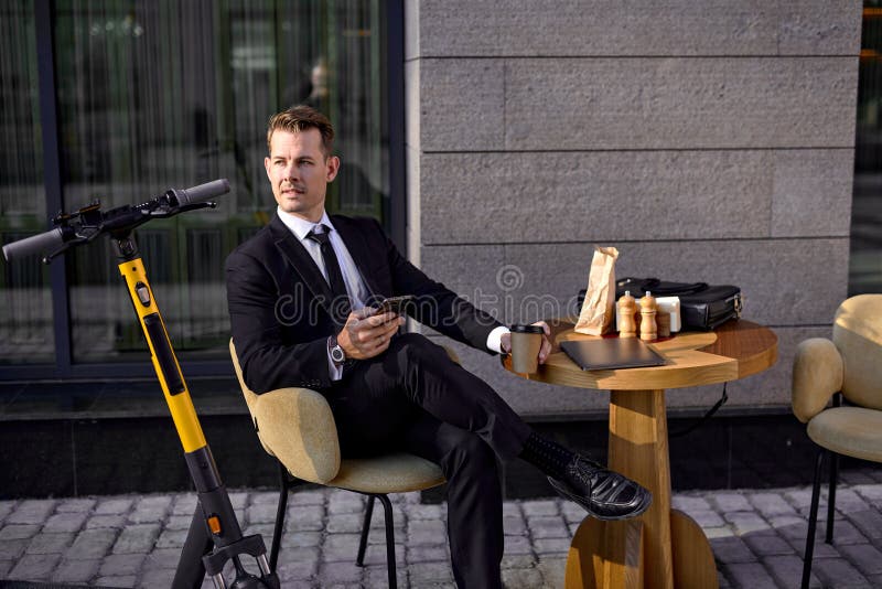 Young Man Sit Outdoors in Cafe Behind Table Using Laptop, Working ...
