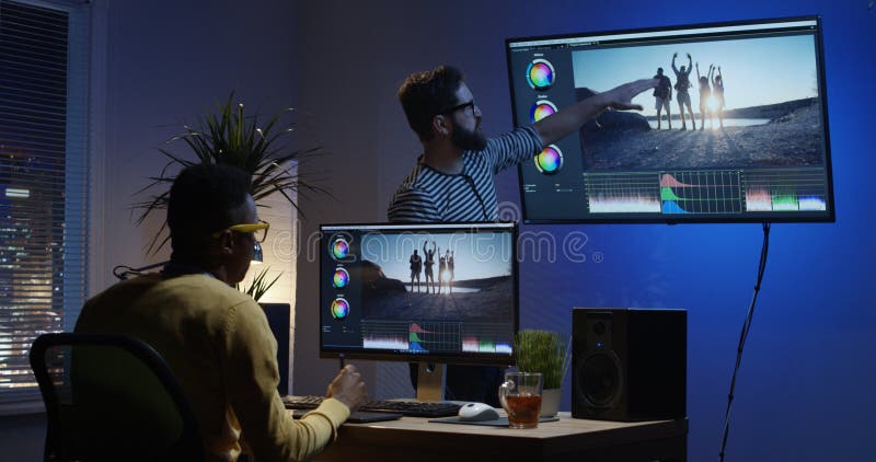 Young Man Sitting Back and Editing a Video Inside a Room Stock Image ...