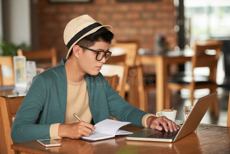 Man studying in cafe stock image. Image of searching - 126073111