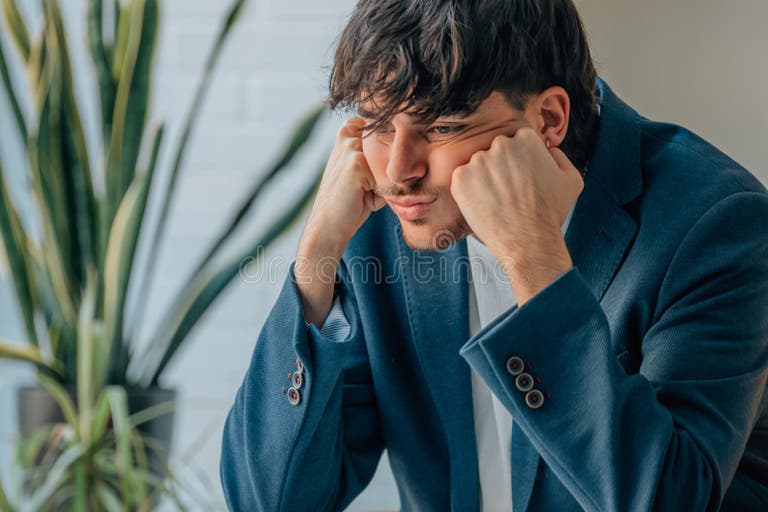 Young Man Sitting with Expression of Problems Stock Photo - Image of ...
