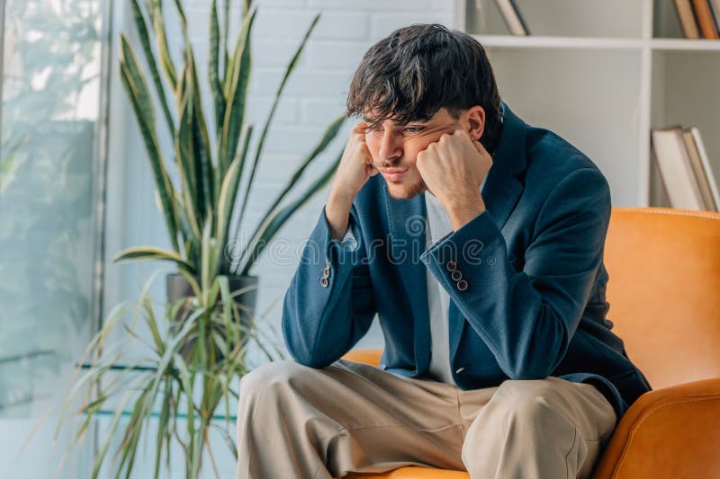 Young Man Sitting with Expression of Problems Stock Photo - Image of ...