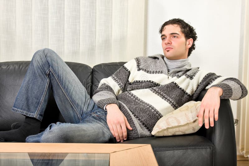 Young Man is Sitting at Home Alone Stock Photo - Image of couch ...