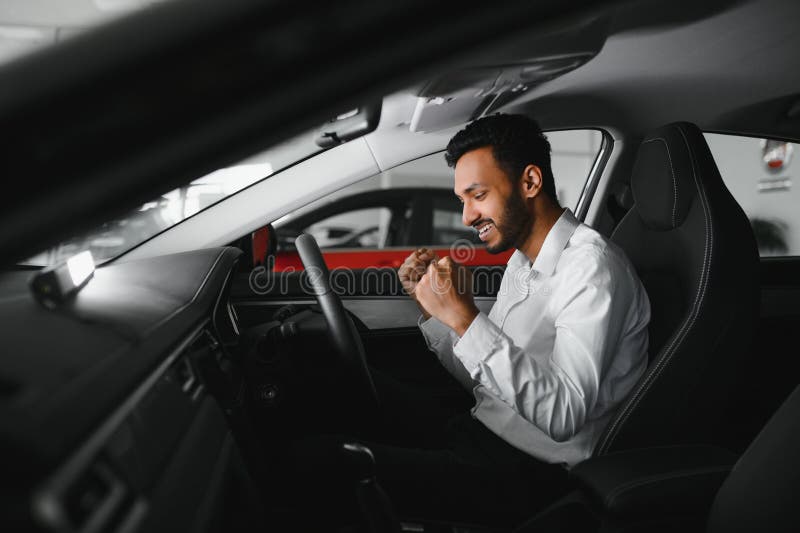 Young Man Sitting Inside New Car. Smiling Stock Image - Image of male ...