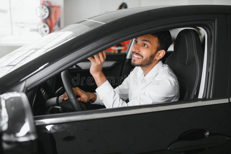 Young Man Sitting Inside New Car. Smiling Stock Image - Image of male ...