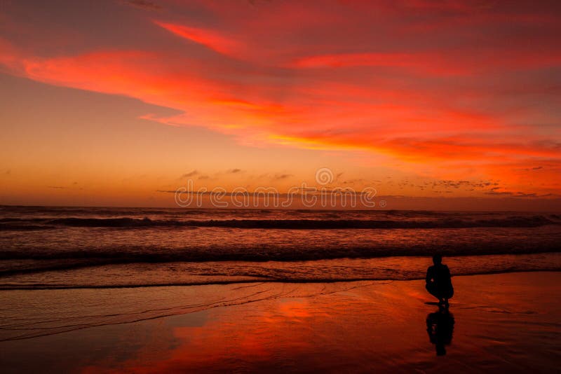 Young Man Sitting Outdoors Watching the Sunset. Thinking and Relaxing ...