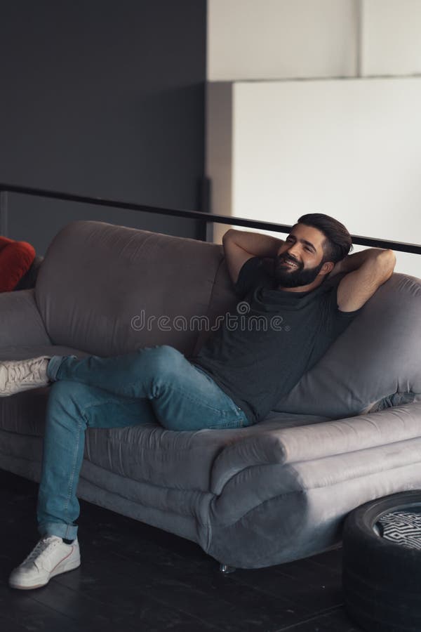 Young Man Sitting Relaxing on the Couch Stock Image - Image of interior ...