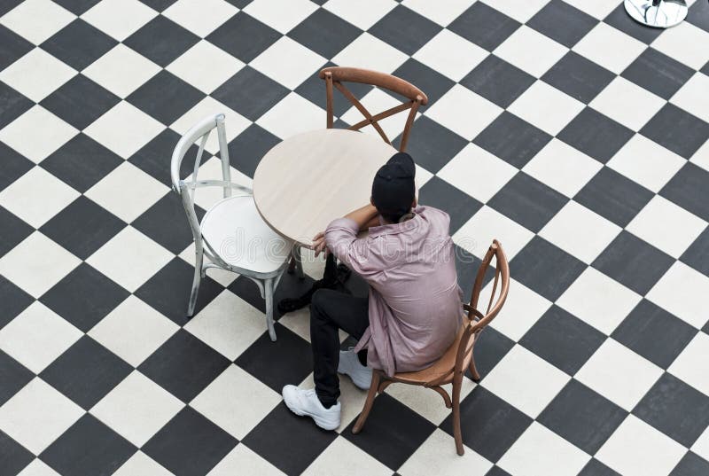 Young Man Sitting at Table, Top View Stock Photo - Image of relax ...