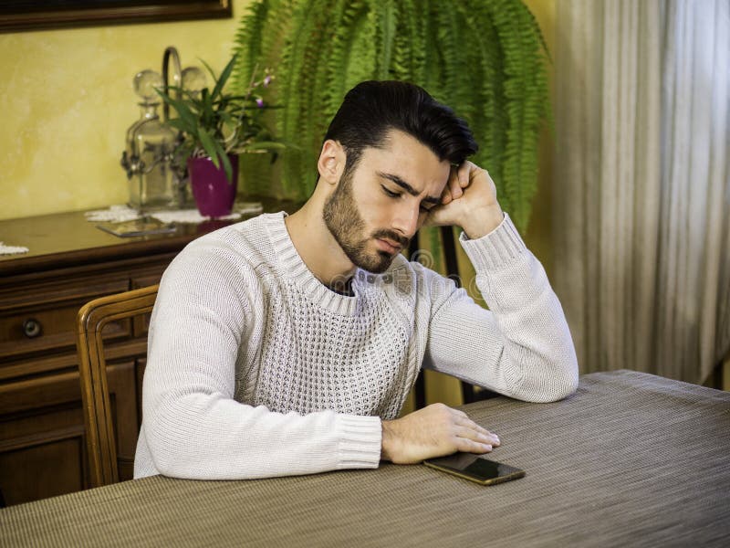 Young man waiting for call stock image. Image of thoughtful - 107119141