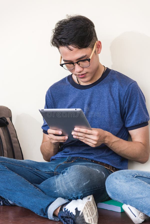Young Man Sitting Useing with Technology Tablet Stock Image - Image of ...
