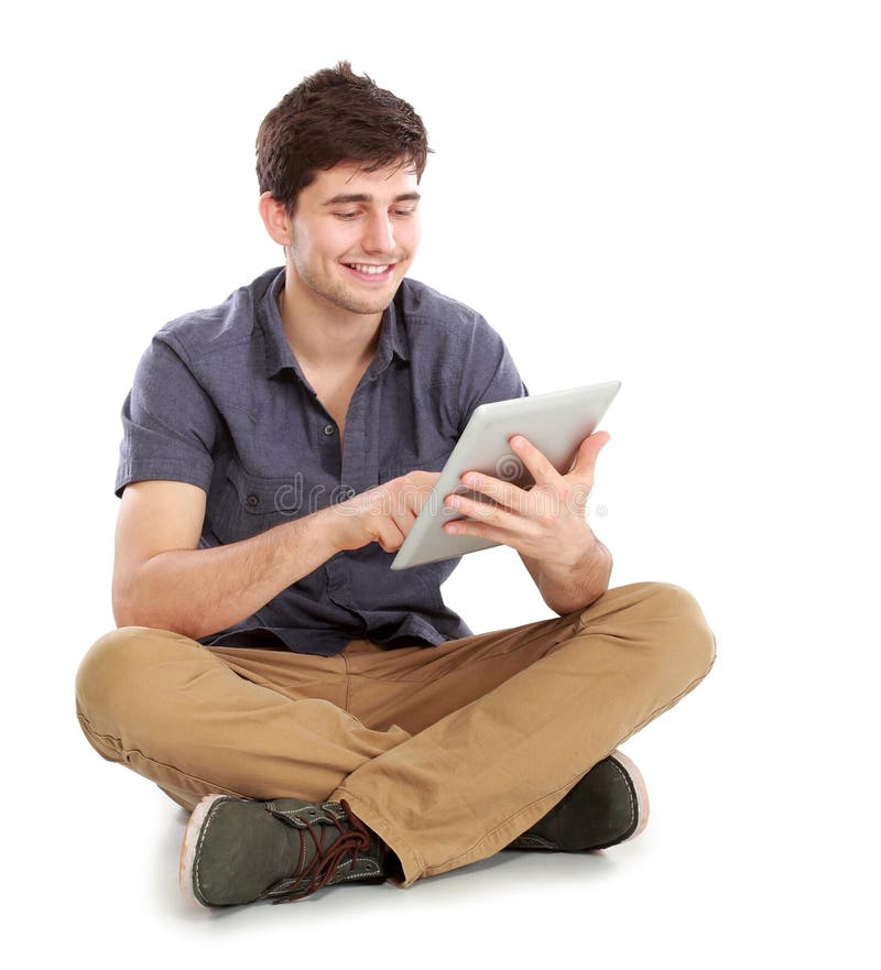Young Man Sitting and Using Tablet Pc Stock Photo - Image of smile ...