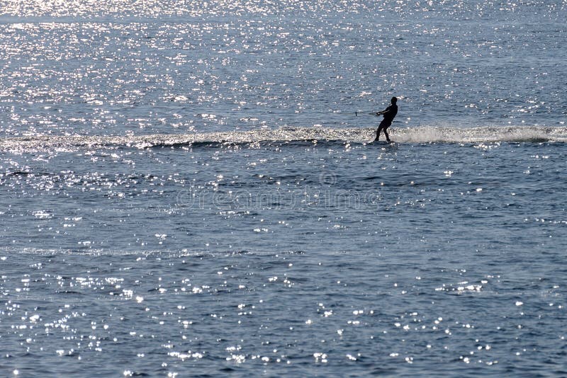 Young Man is Skiing in the Sea Stock Image - Image of skiing, action ...