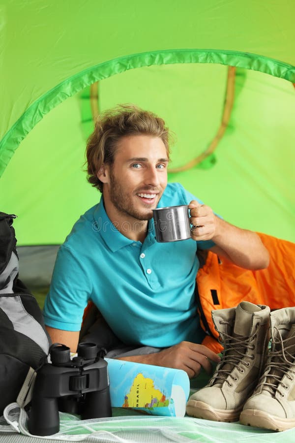 Young Man in Sleeping Bag with Mug Inside Stock Image - Image of ...