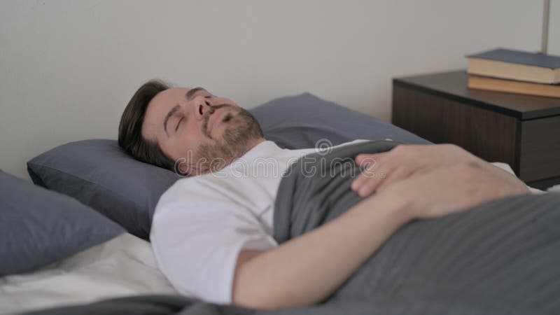 Young Man Sleeping in Bed Peacefully Stock Photo - Image of tired ...