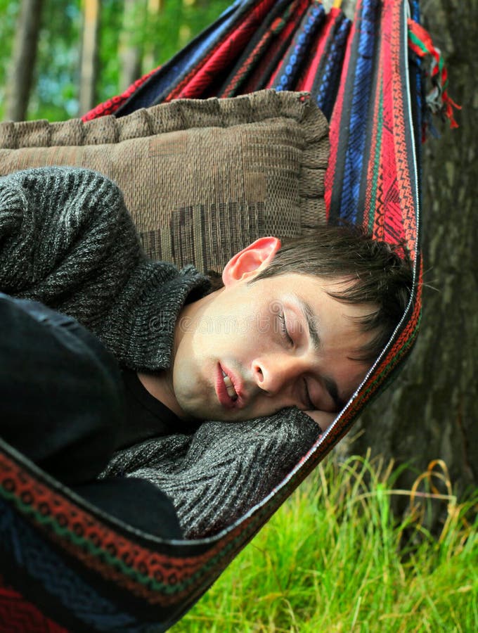 Young Man sleeping outdoor stock image. Image of hammock - 63784931