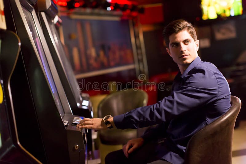 Young Man with Slot Machine in the Casino Stock Image - Image of ...