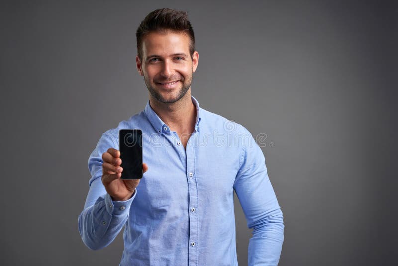 Young Man with a Smartphone Stock Photo - Image of mobile, holding ...