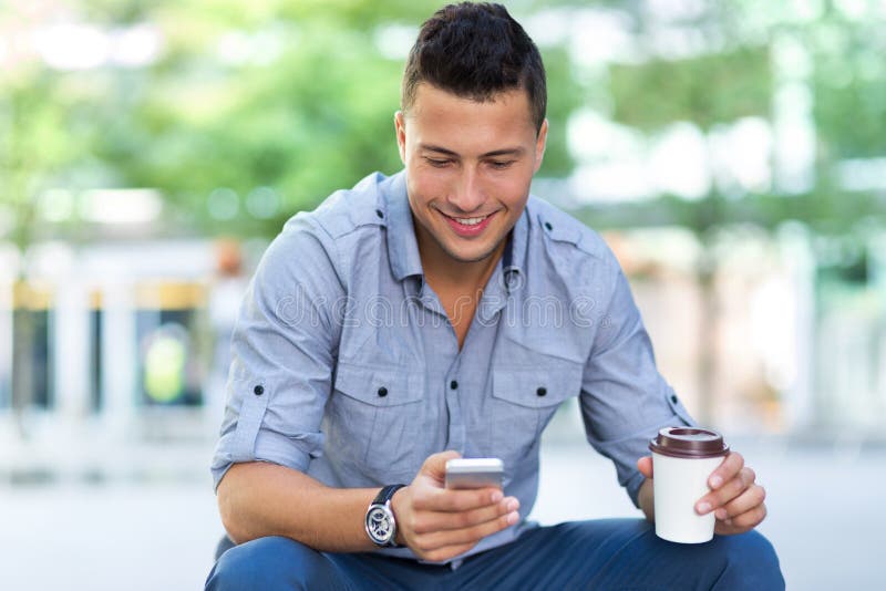 Young man with smartphone stock image. Image of male - 73419969