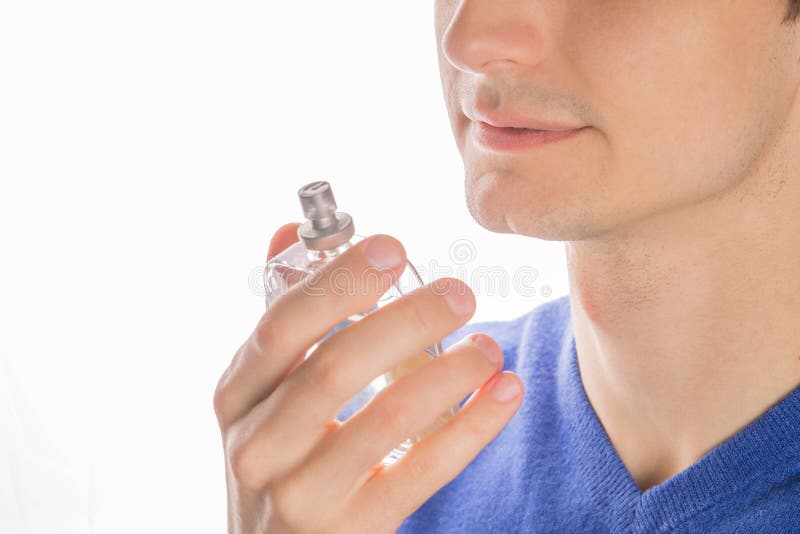 Man smelling perfume stock photo. Image of bottle, hands - 13143842