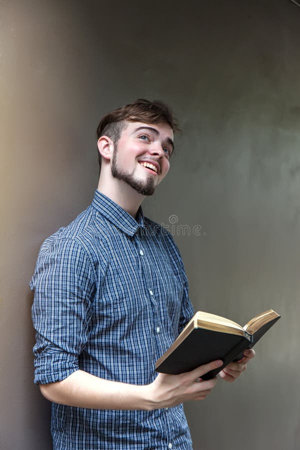 Young Man Smile and Reading the Bible Book Stock Photo - Image of face ...