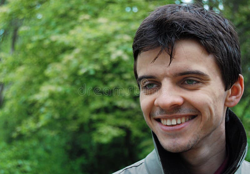 Young man smiling stock image. Image of male, bushes, emotion - 7328217