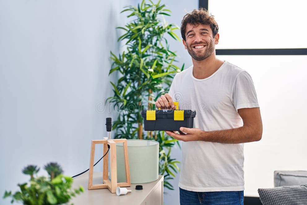 Young Man Smiling Confident Holding Tools Box at Home Stock Image ...