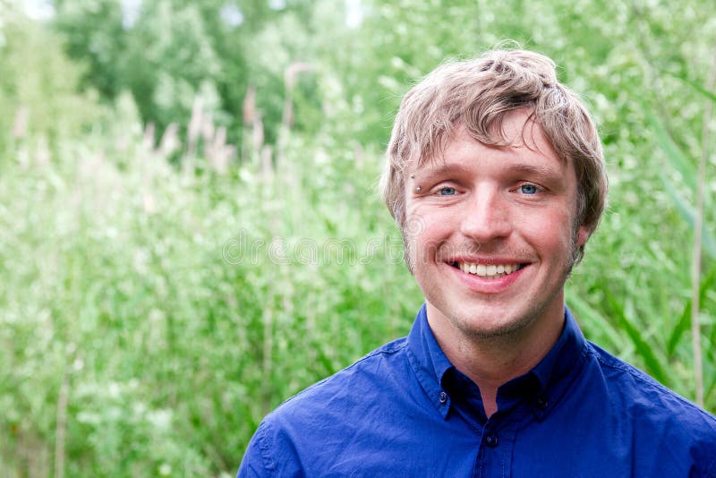 Young man smiling friendly stock photo. Image of positive - 41092554